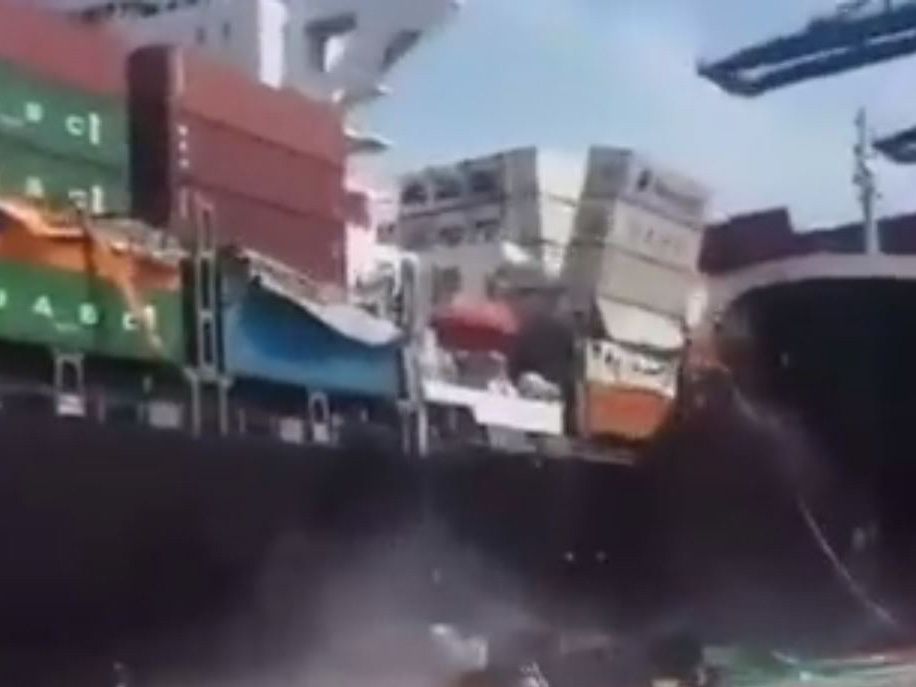 Video shows shipping containers fall from deck into…