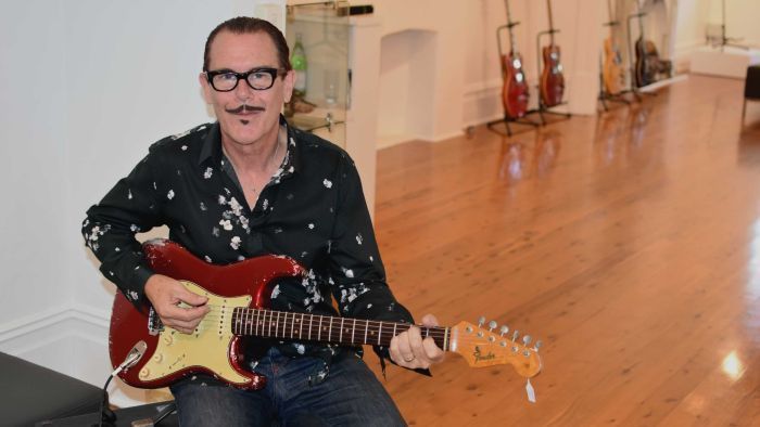 INXS guitarist auctions away his rare collection