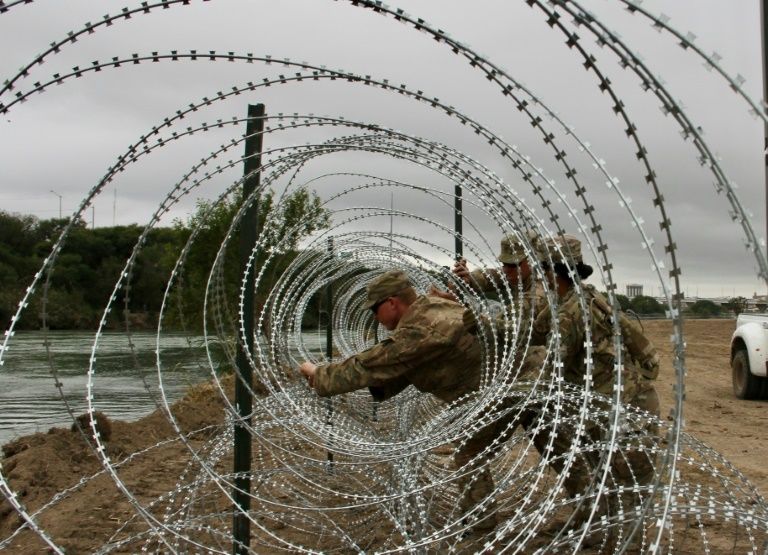 US Army unfurls miles of fencing along border with…