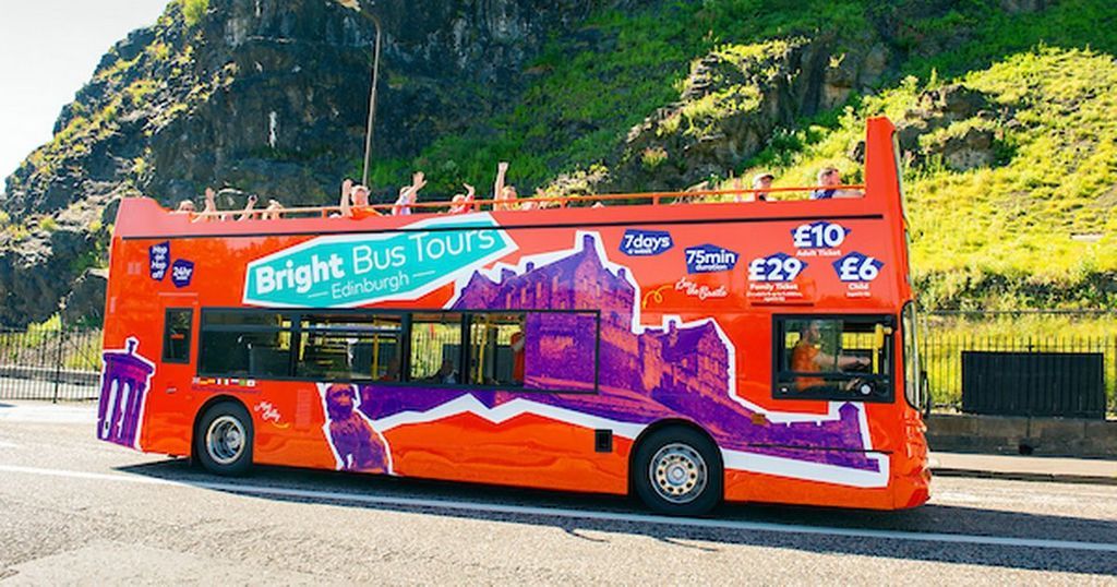 New, bright-orange tour buses in Edinburgh city centre…