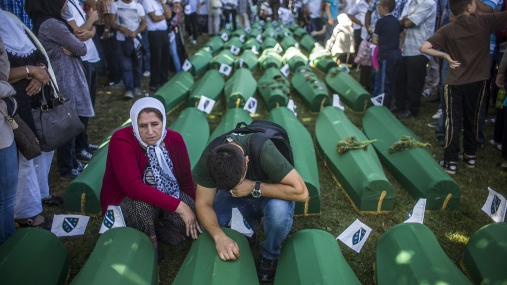 What are the 10 stages of genocide?
