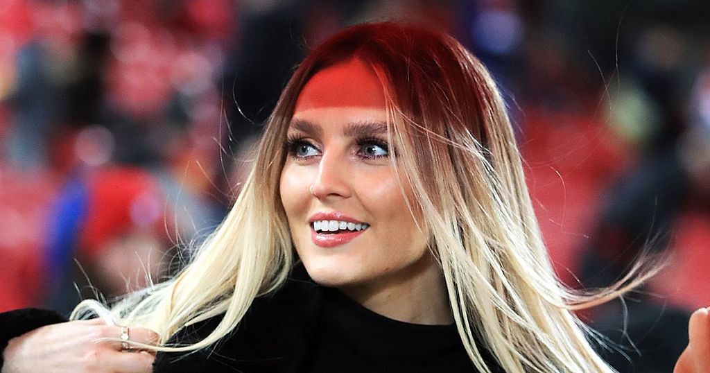 Perrie Edwards turns heads at Anfield in faux fur coat…