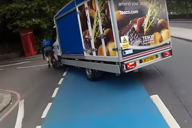 Shocking moment London cyclist is knocked off bike by…