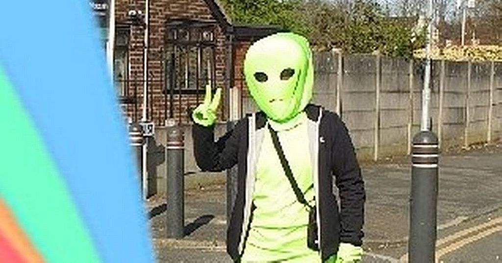 Person dresses up in alien costume to do essential…