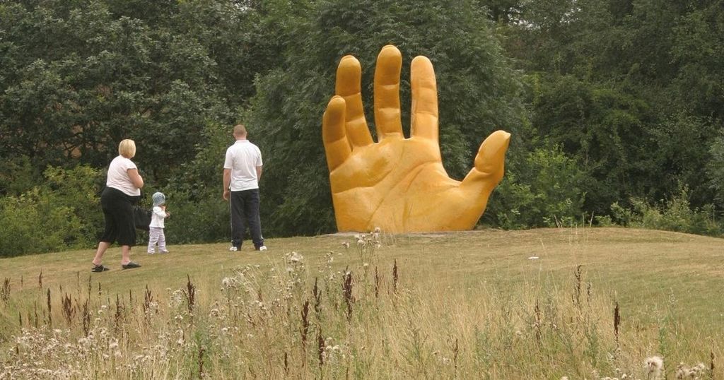 ‘Striking’ 10ft golden hand sculpture in this…